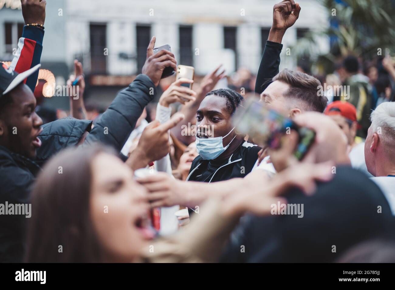 London | UK - 2021.07.12: English fans waving flags at Leicester Square ...