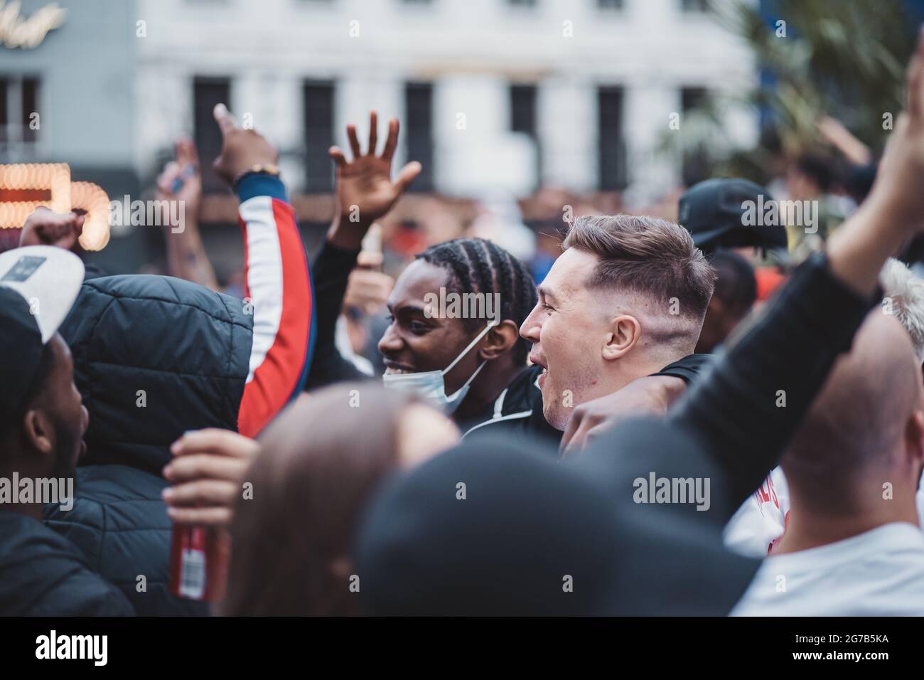 London | UK - 2021.07.12: English fans waving flags at Leicester Square ...