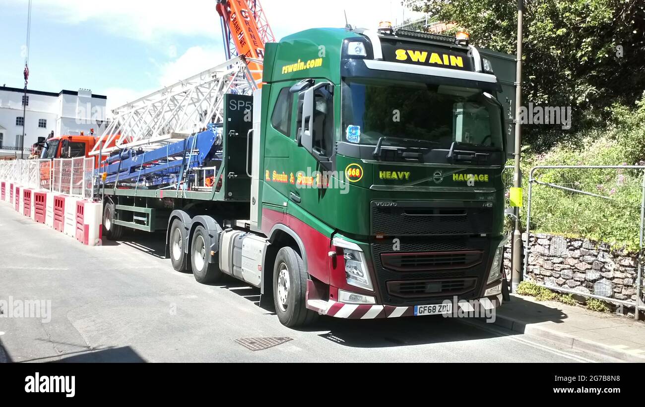 A Volvo FH16 articulated lorry with flatbed trailer parked in Torquay ...
