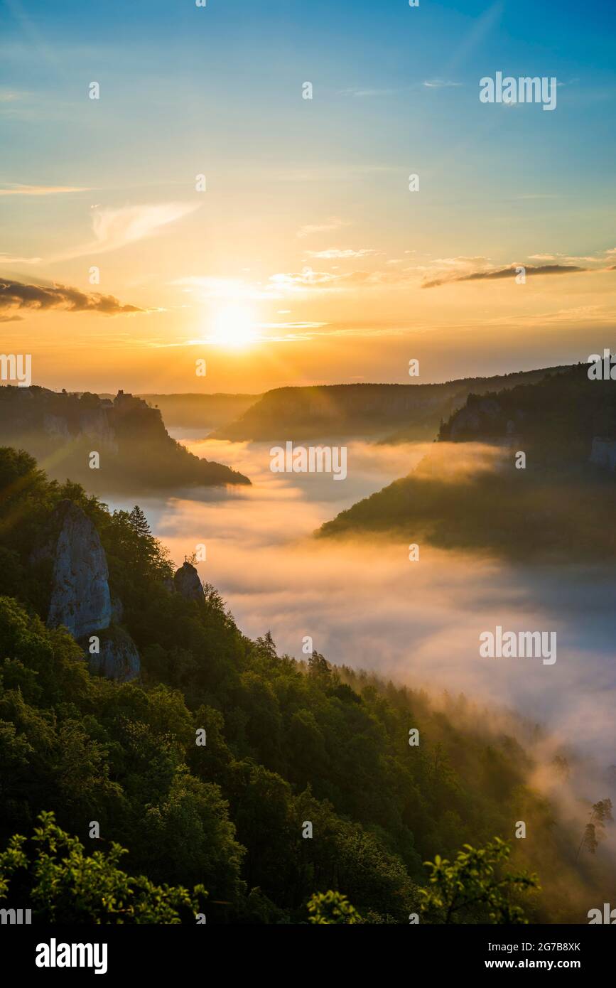 View from Eichfelsen to Werenwag Castle with morning fog, sunrise, near ... View from Eichfelsen to Werenwag Castle with morning fog, sunrise, near ...