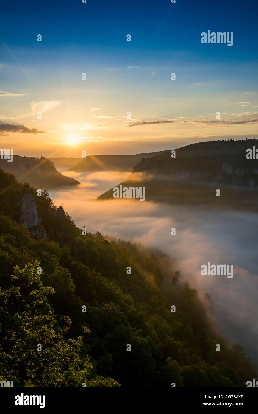 View from Eichfelsen to Werenwag Castle with morning fog, sunrise, near ... View from Eichfelsen to Werenwag Castle with morning fog, sunrise, near ...
