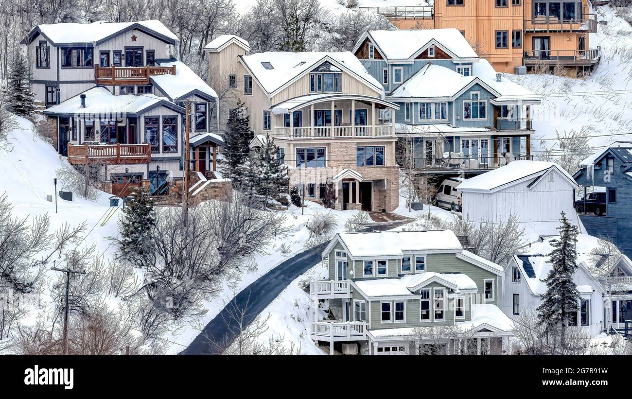 Pano Aerial view of snowy neighborhood in winter on a mountain town ...