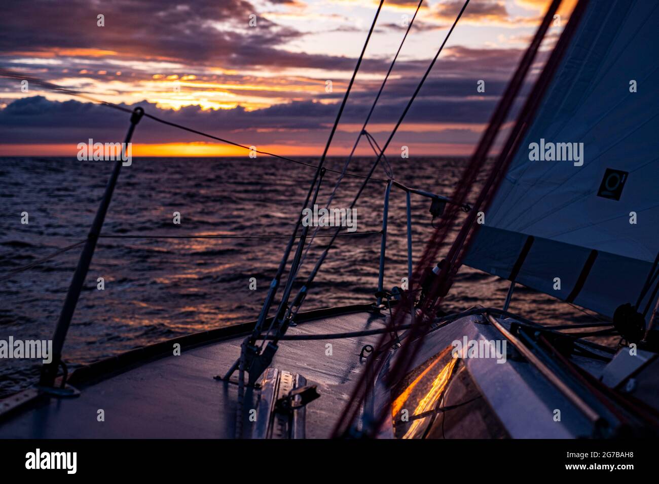 North Sea sailing on a half-tonner at sunset Stock Photo - Alamy