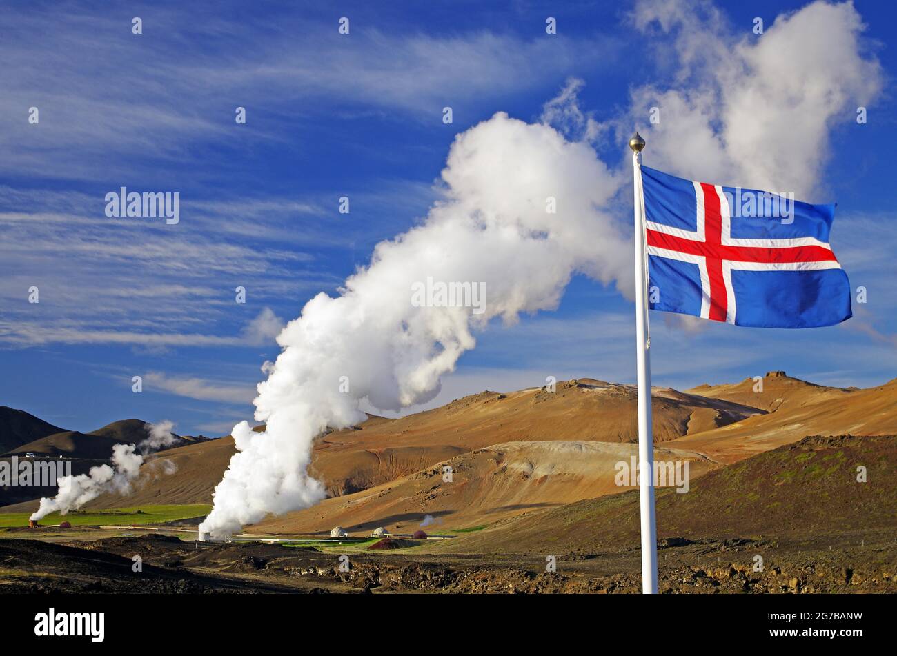 Icelandic flag in front of hot steam plumes, geothermal fields in the ...