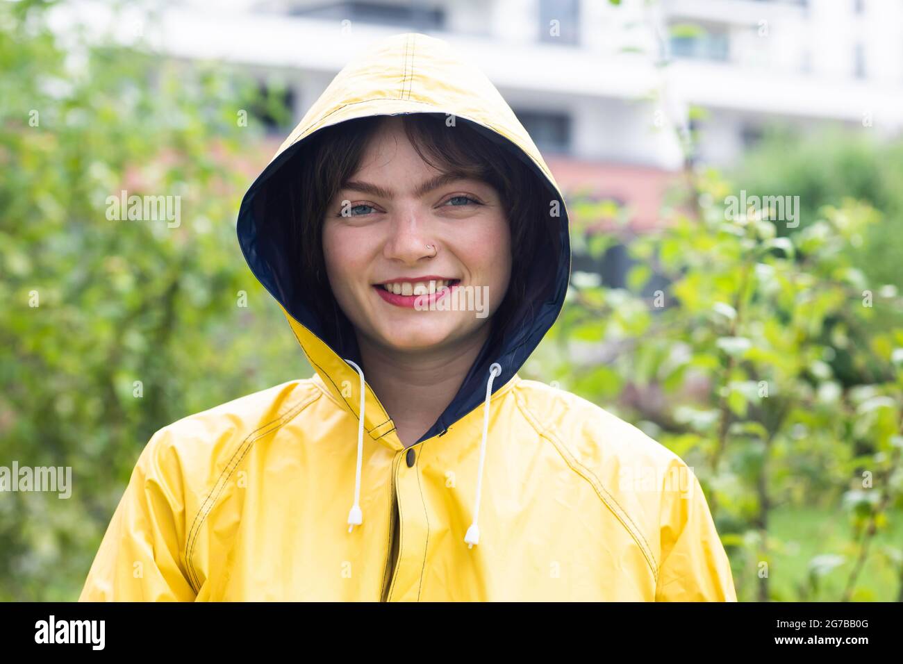 Person raincoat yellow hi-res stock photography and images - Alamy