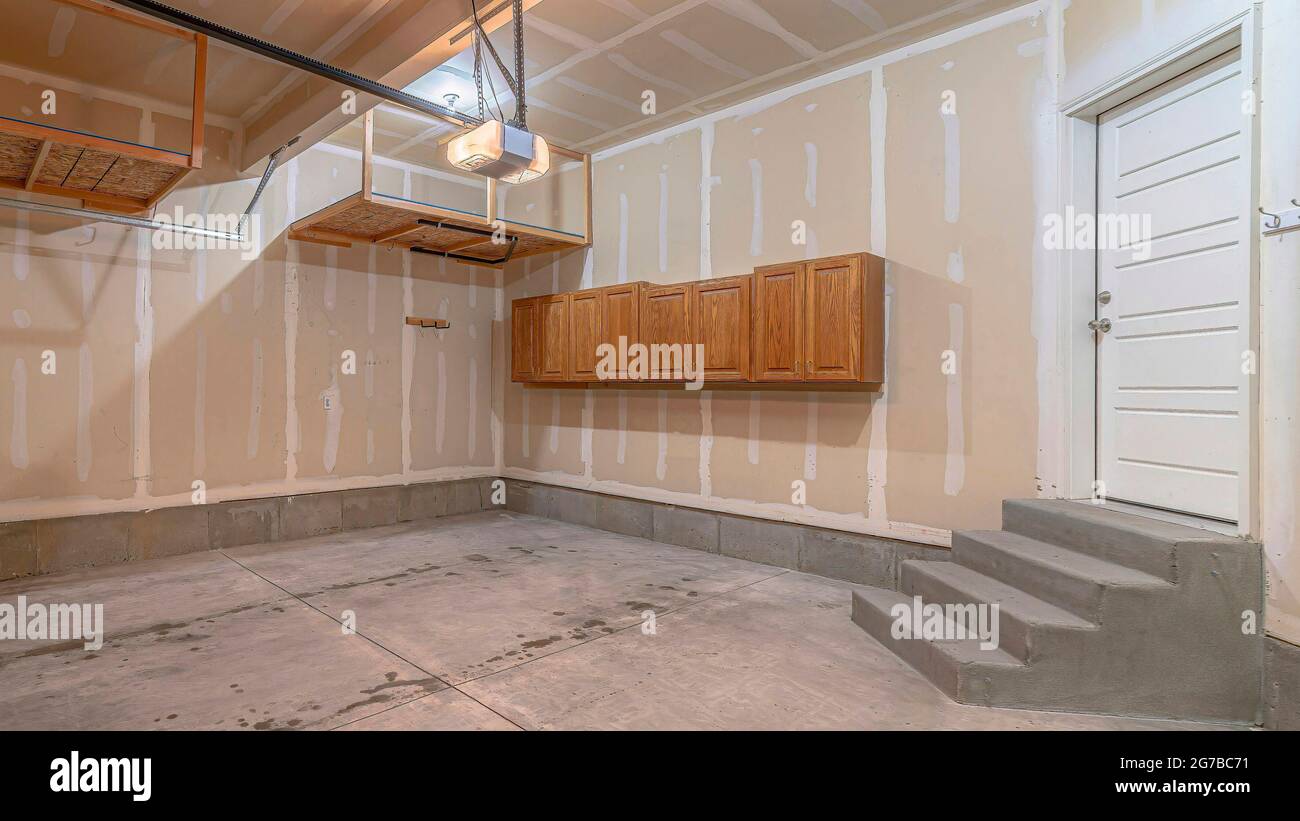 Pano Residential garage interior under construction with unfinished ...