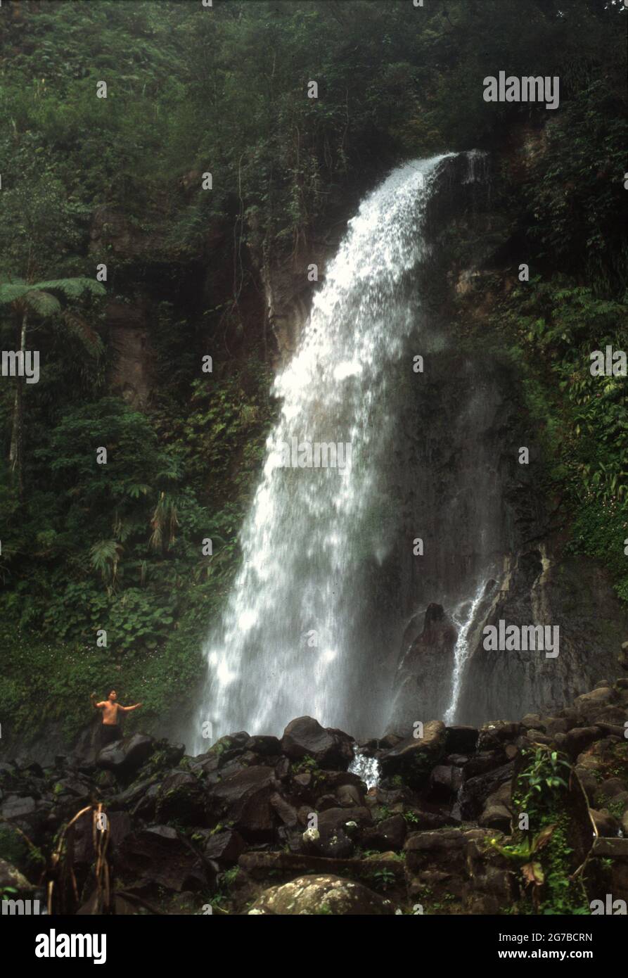 People having a recreational time at Cibeureum waterfall in Mount Gede ...