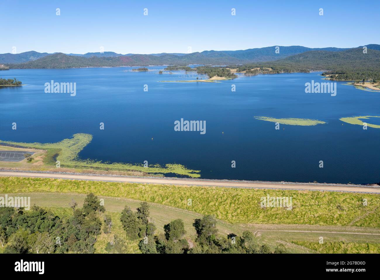 Aerial over rock wall towards the water catchment area Teemburra Dam ...