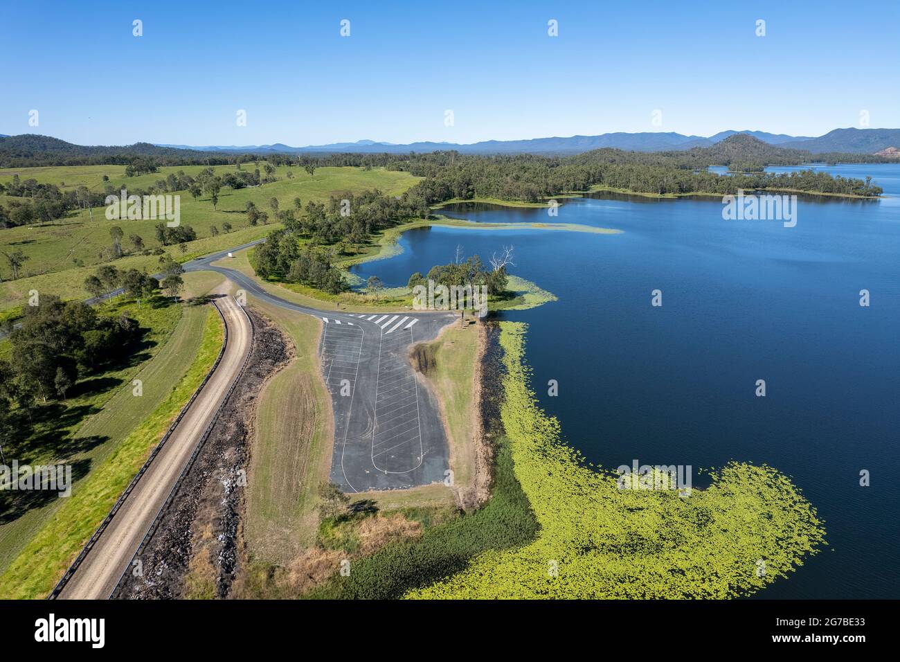Aerial over Teemburra Dam Australia boat ramp car park and rock wall ...