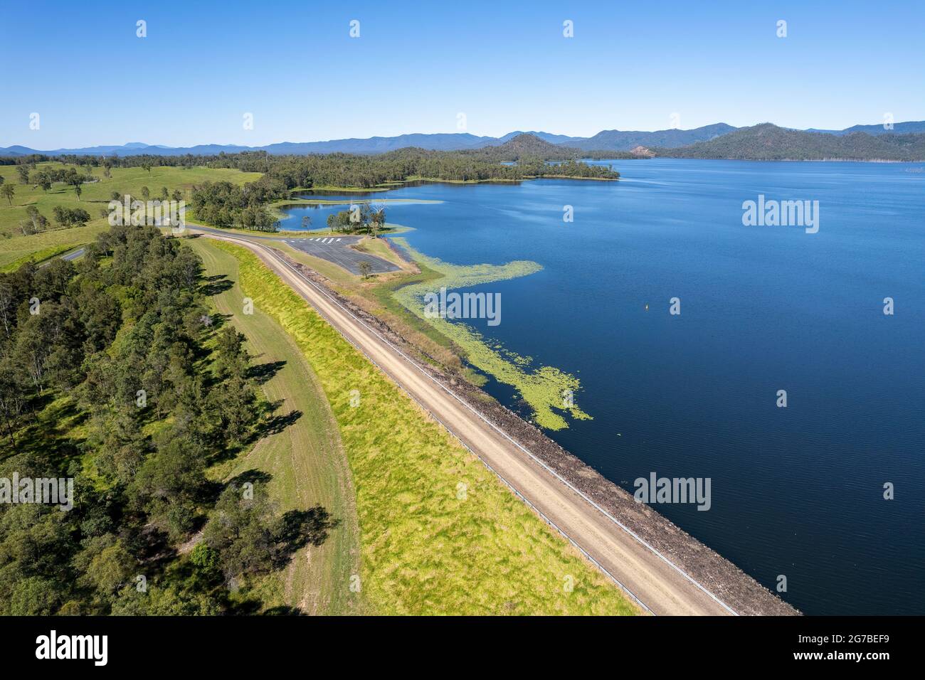 Aerial over Teemburra Dam Australia showing rock wall and water expanse ...