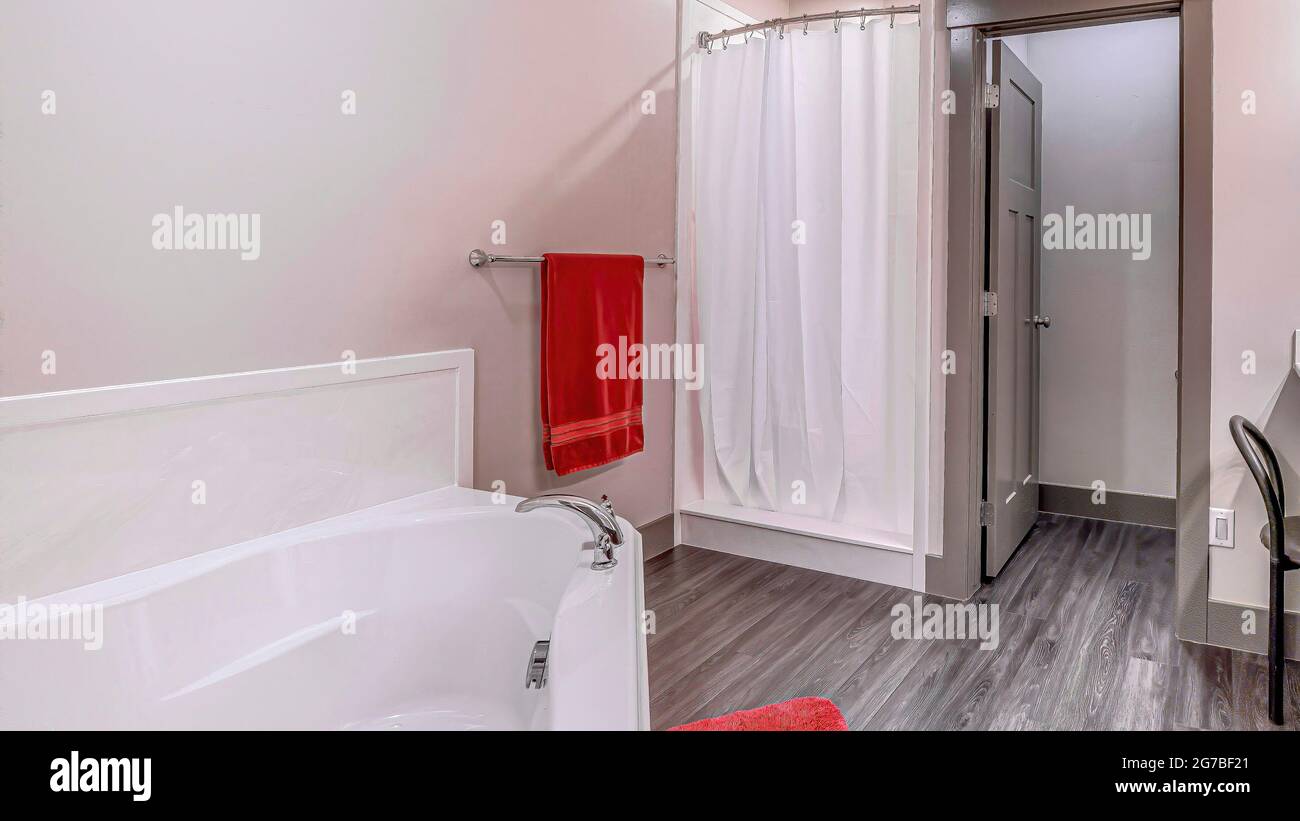 Pano Clean bathroom with shower stall bathtub and vanity area with ...