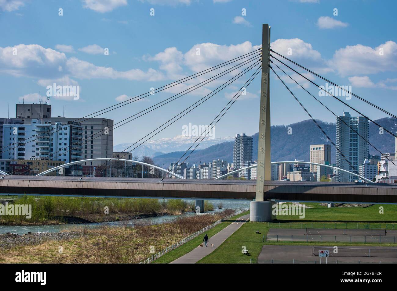 Massive bridge spanning across the Ishikari river flowing through ...