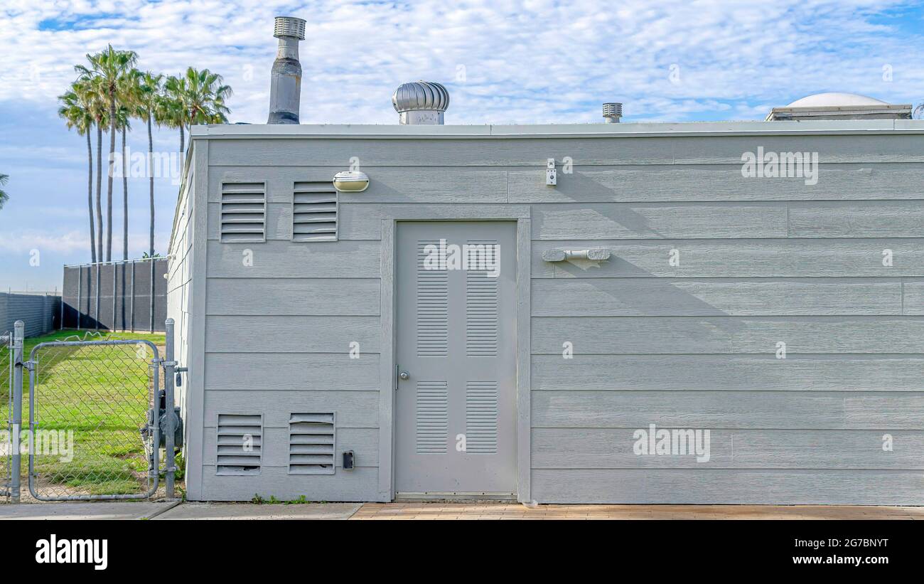 Pano Building with flat roof and gray exterior wall in Huntington Beach ...