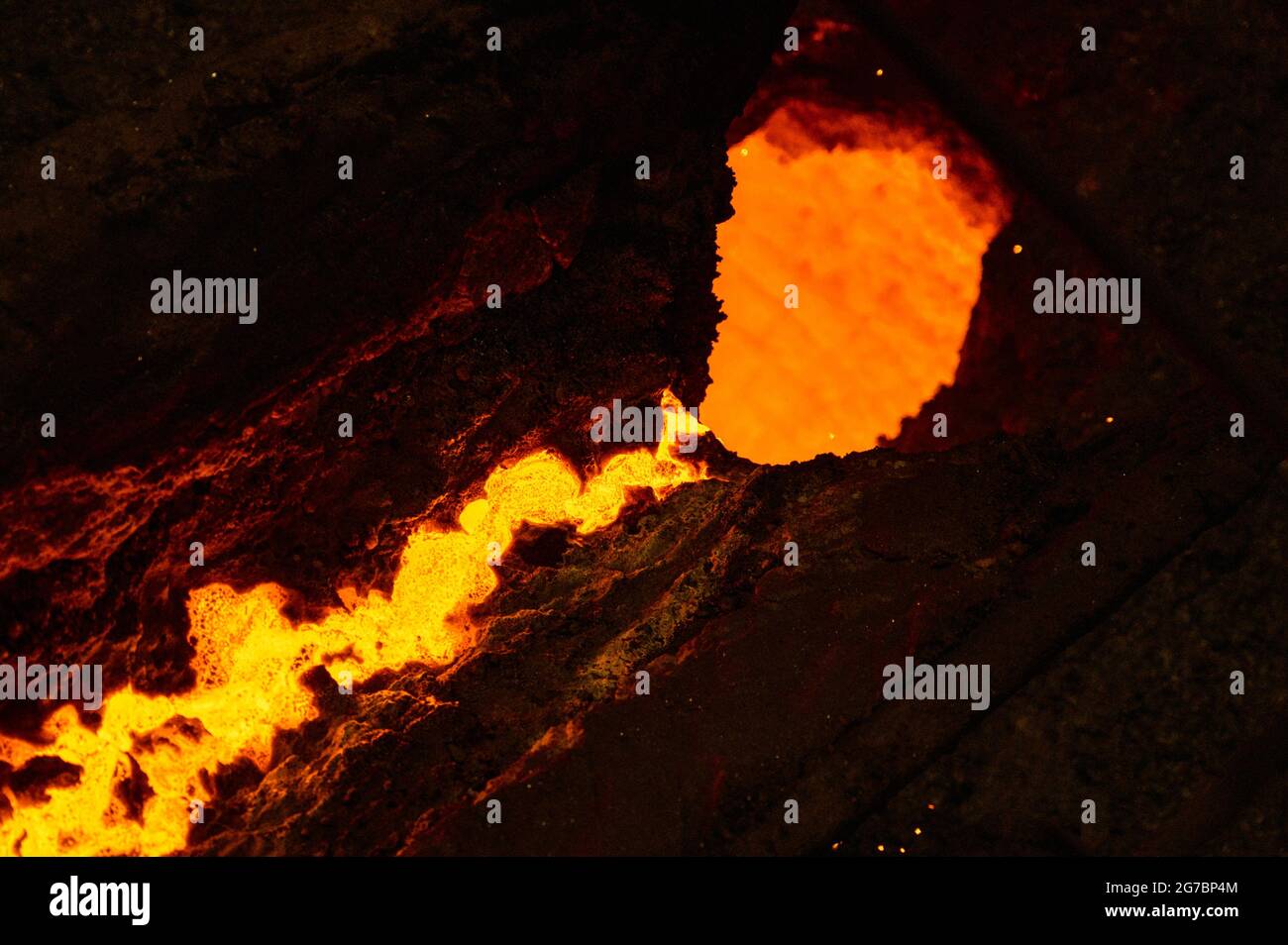 The hot inner surface of the metallurgical ladle. A hole in a thick ...