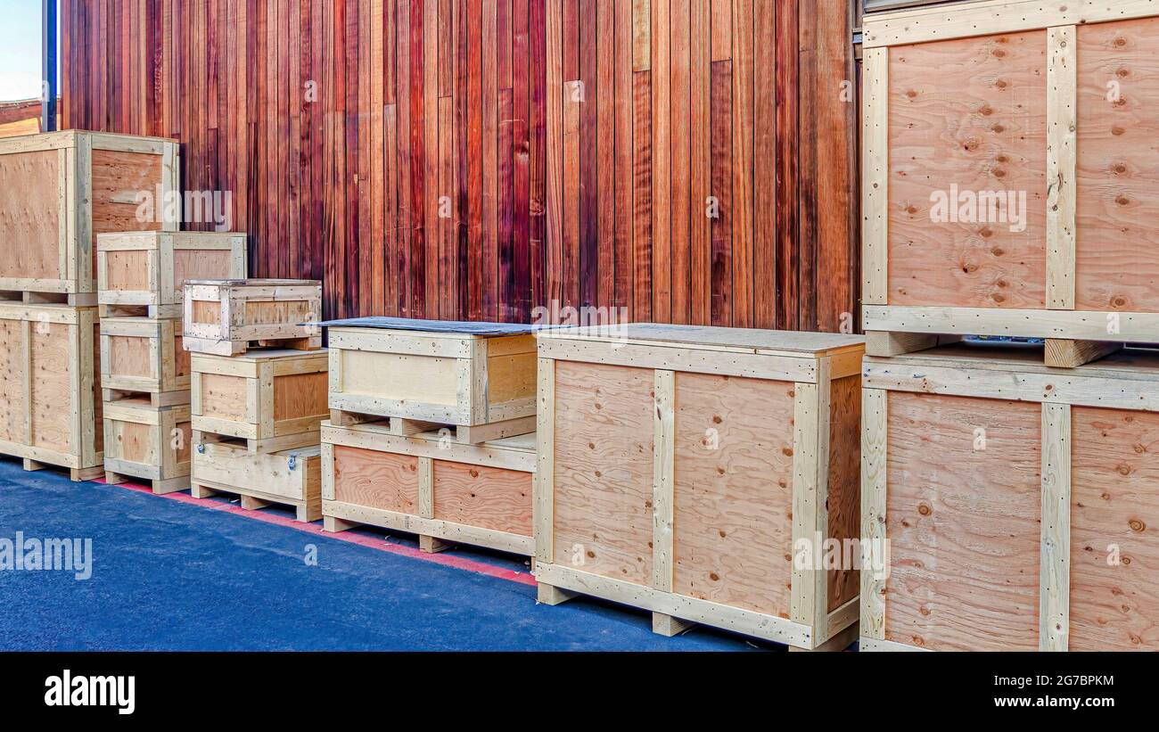 Pano Crate container boxes against exterior wall and ventilator window ...