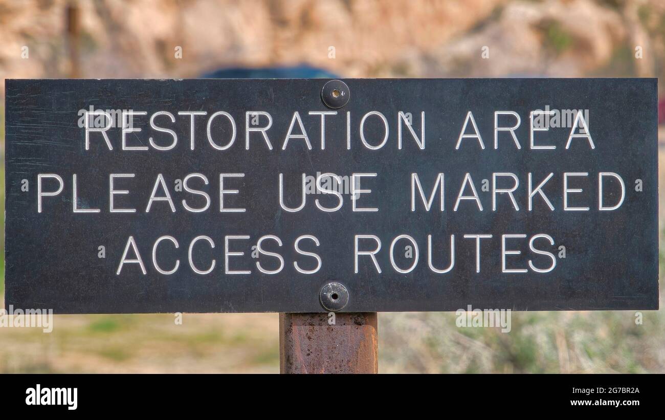 Pano Restoration Area sign agaisnt desert landscape at Joshua Tree ...