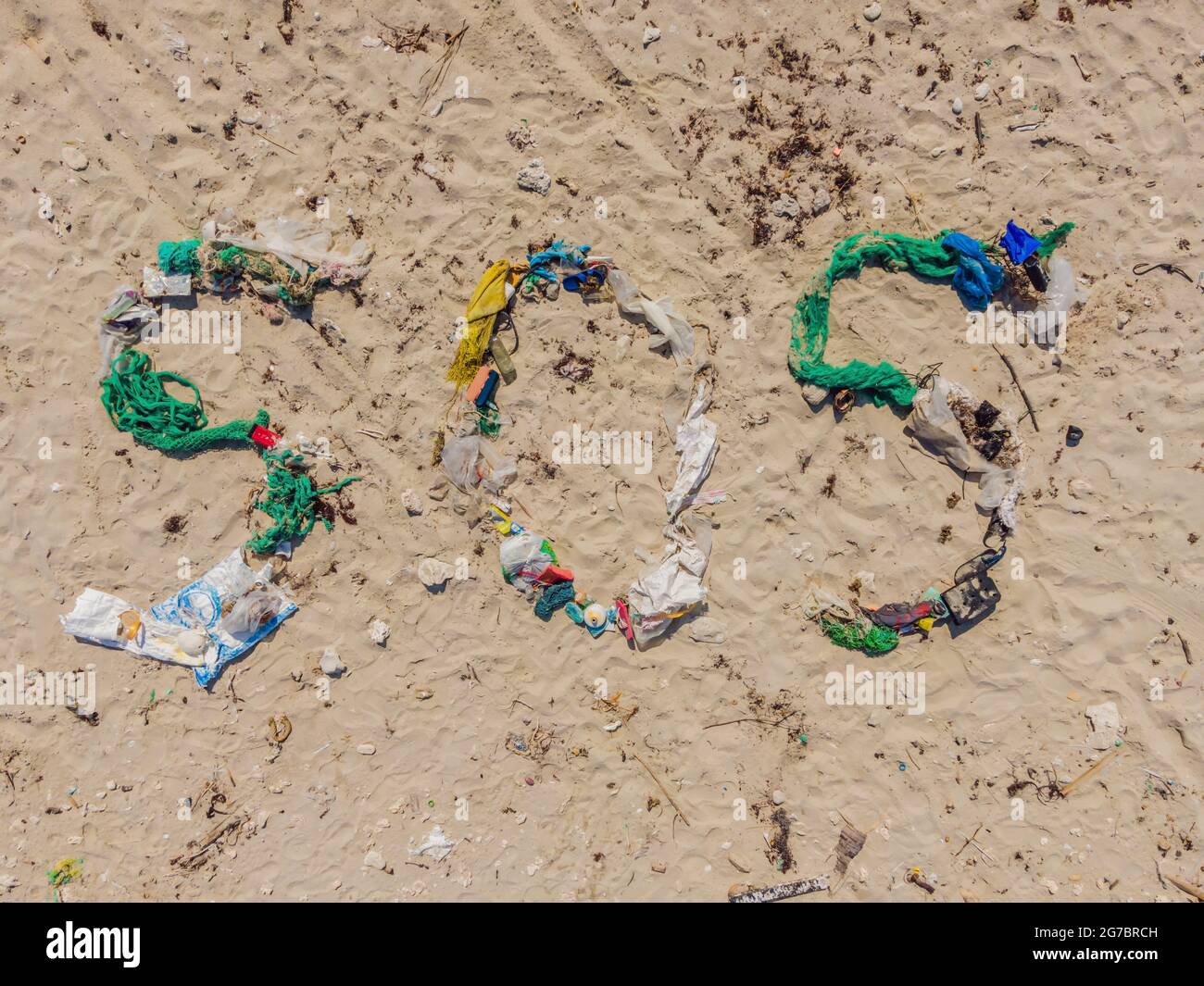 Environmental problem. Ecology concept. Plastic on the beach with sos ...