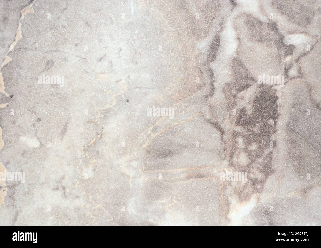 Light gray marble with dark veins and inclusions. Background, pattern ...
