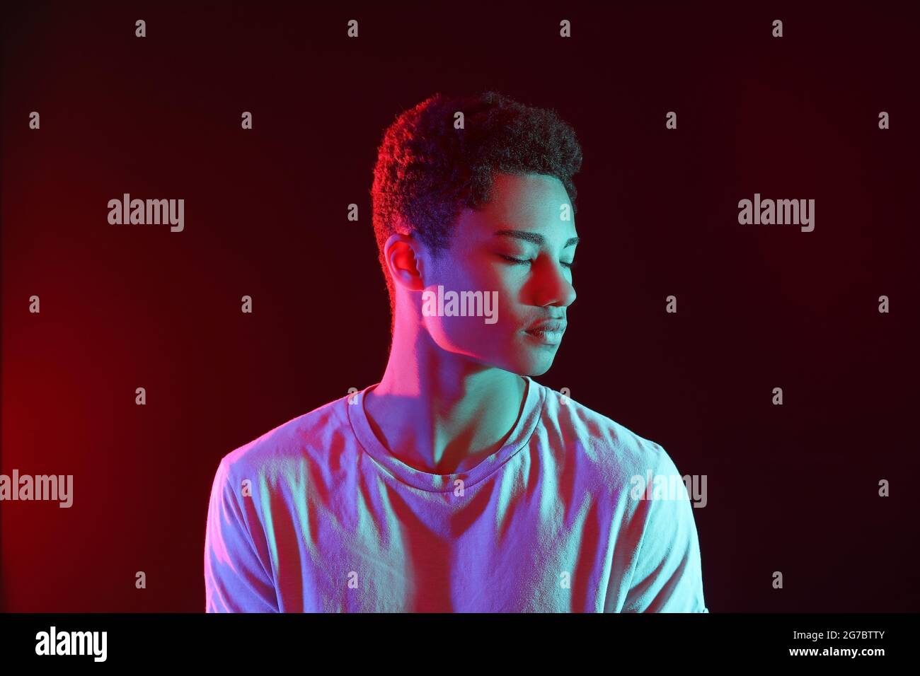 Portrait of African-American teenage boy on color background Stock ...