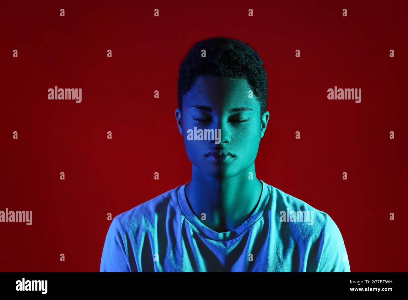 Portrait of African-American teenage boy on color background Stock ...