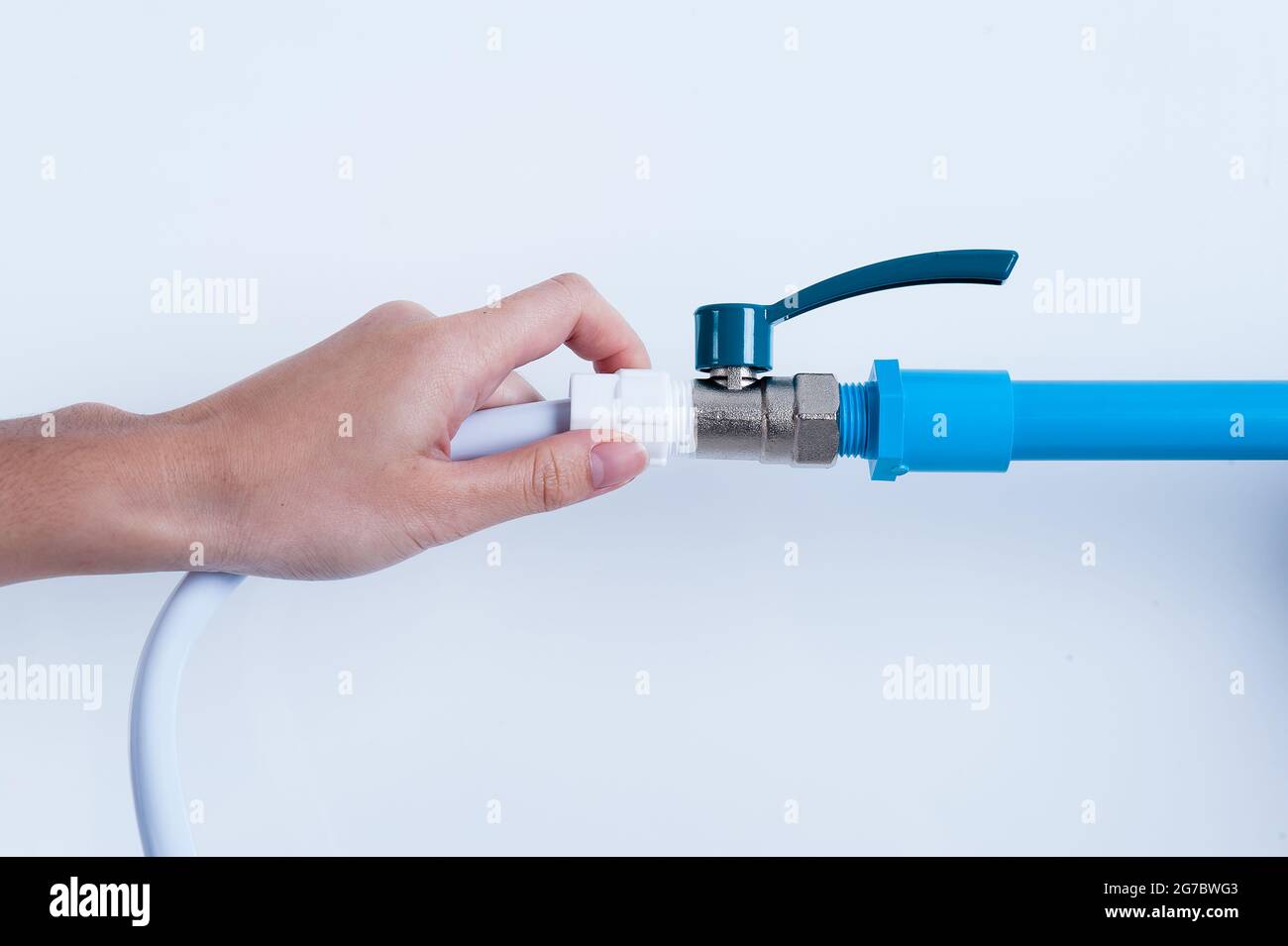 hand with pipe and valve Stock Photo - Alamy