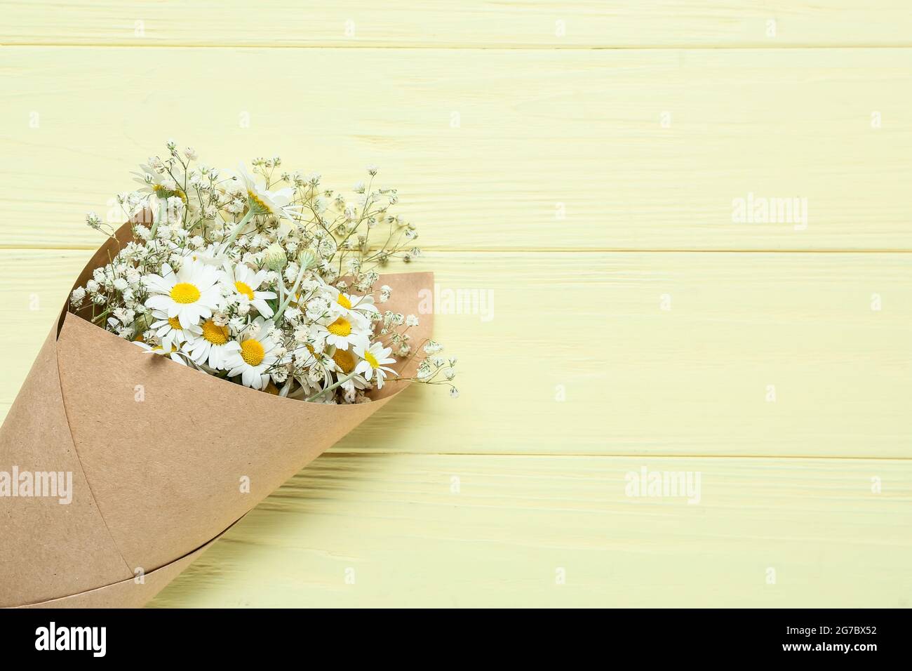 Bouquet of beautiful chamomile flowers on color wooden background Stock ...