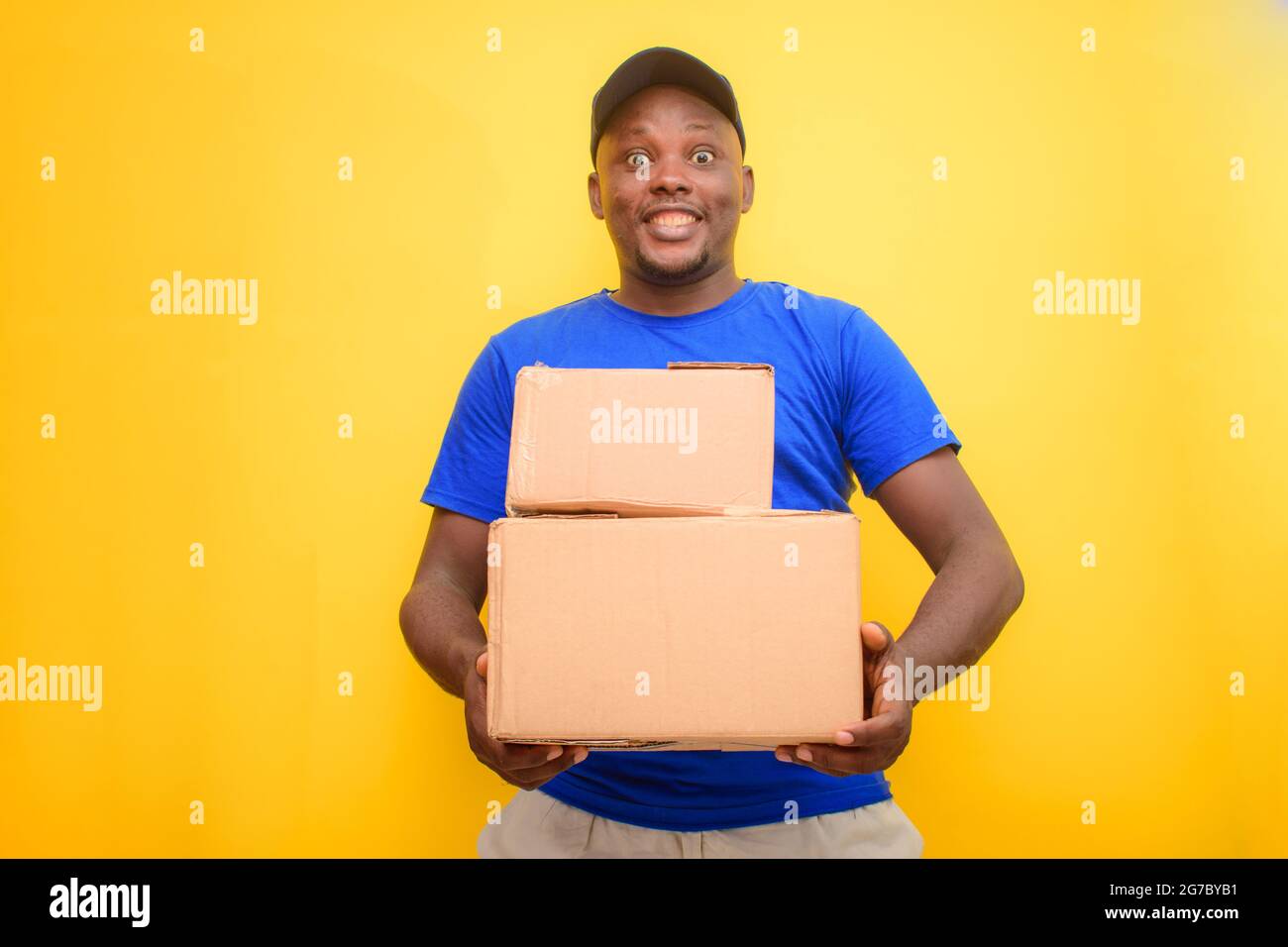 An African delivery personnel or dispatch man wearing a blue shirt ...