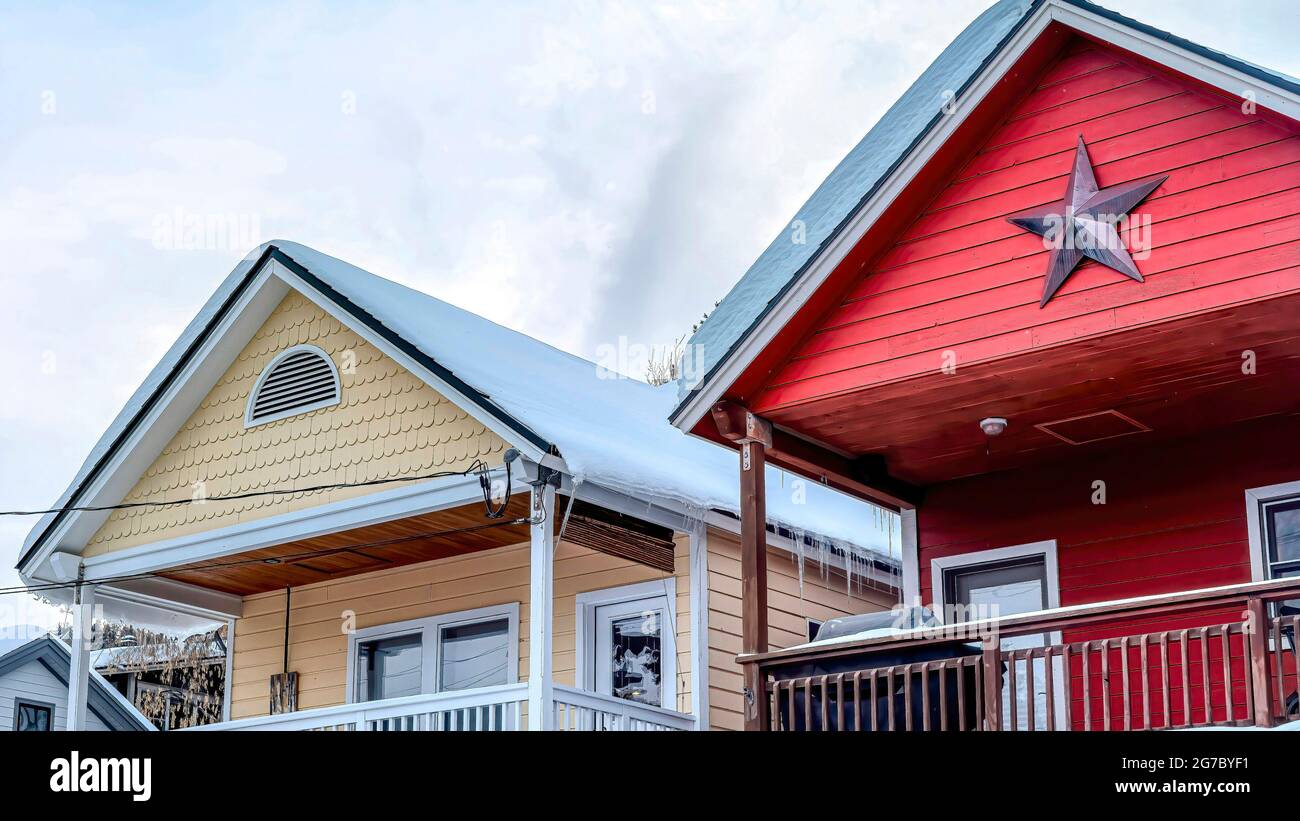 Pano Two storey homes with balconies snowy gable roofs and garages at ...