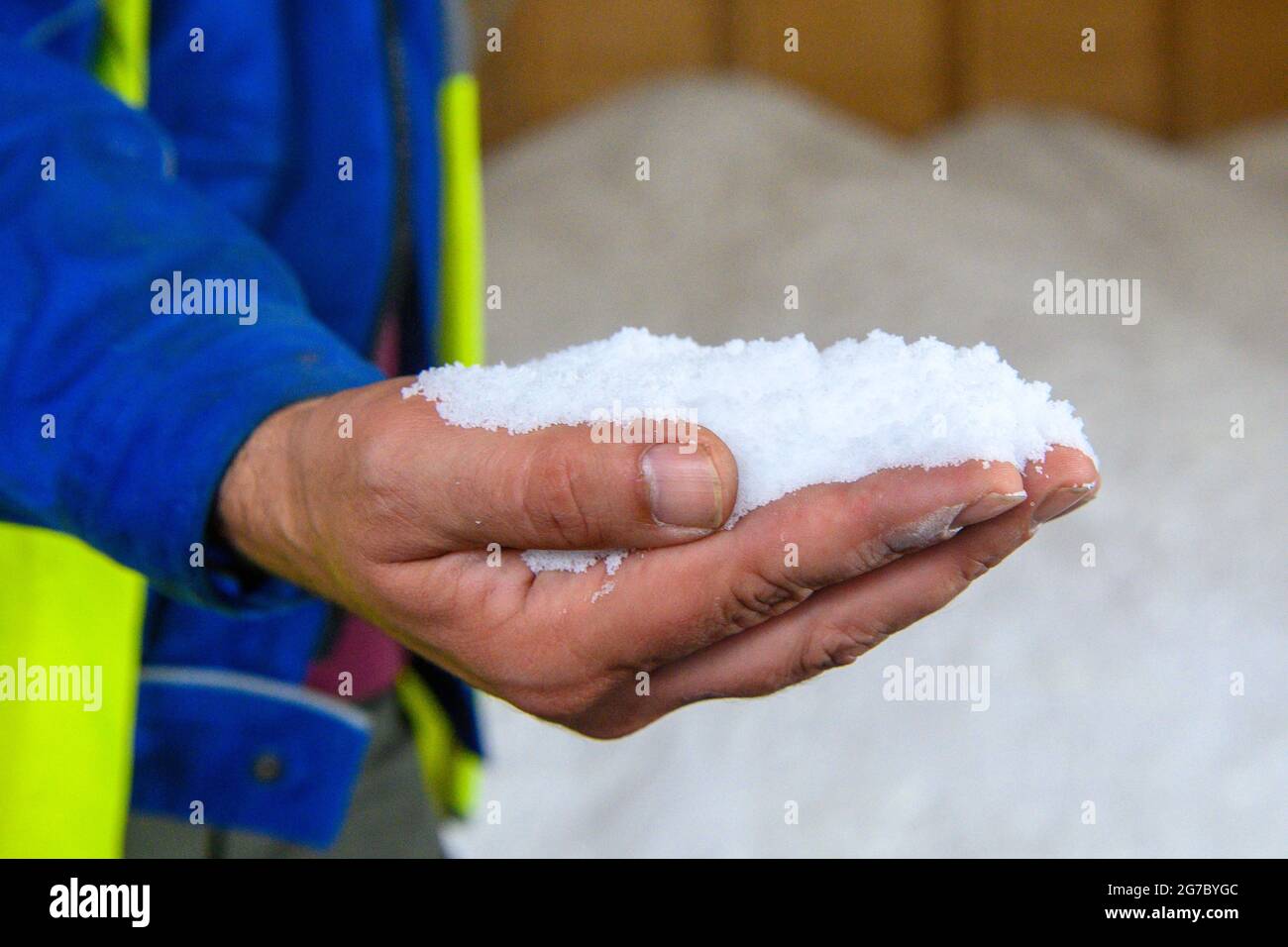 12 July 2021, Saxony-Anhalt, Staßfurt: An employee of the chemical ...