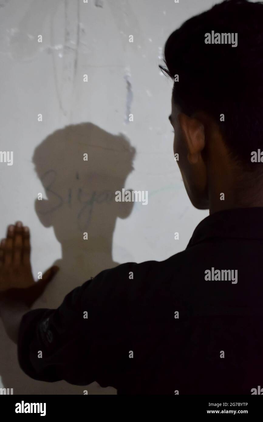 Man and his shadow Stock Photo - Alamy