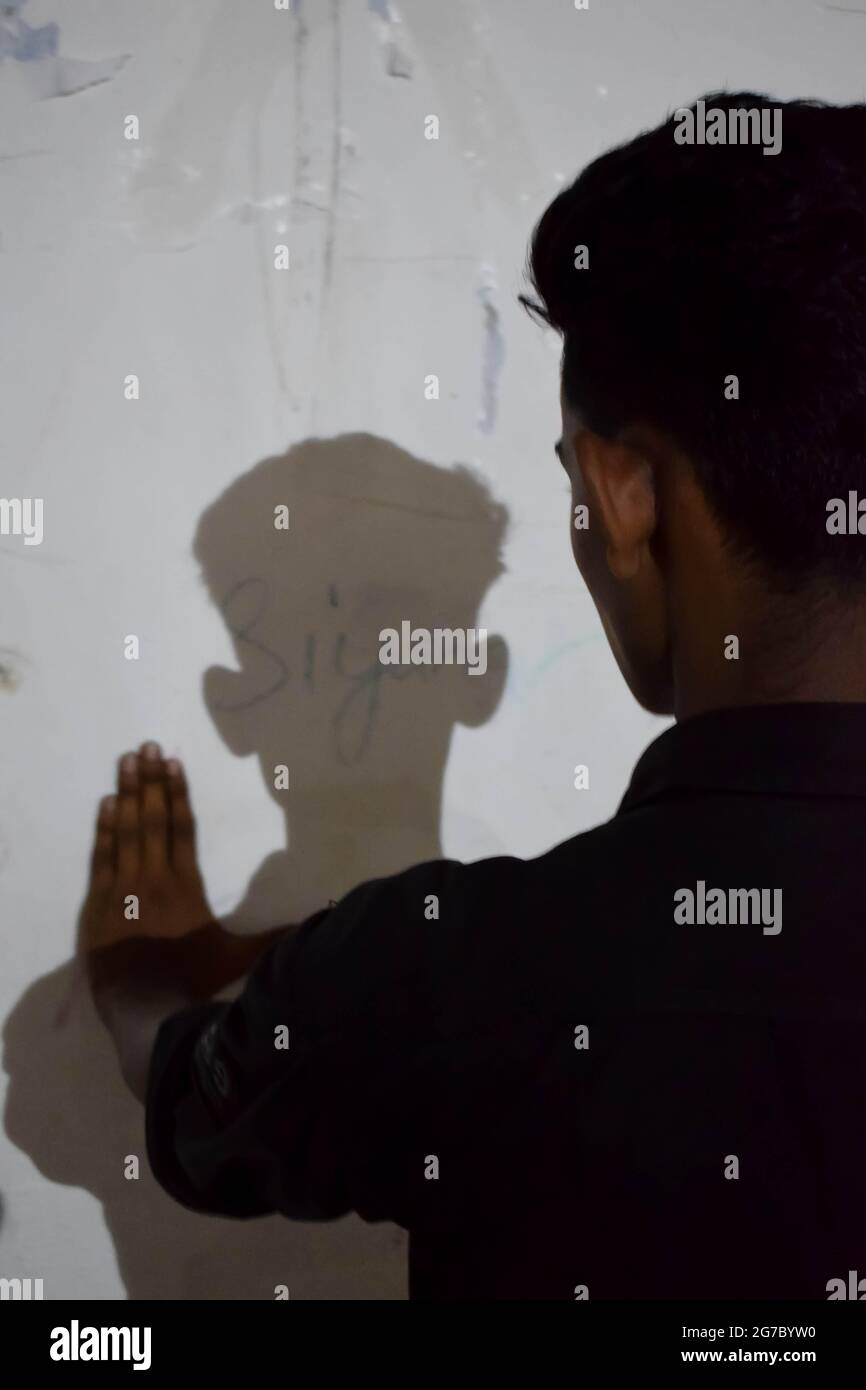 Man and his shadow Stock Photo - Alamy