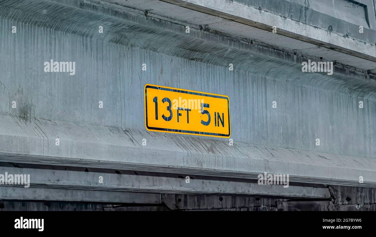 Pano Close up view of a vertical clearance sign at the side of a ...