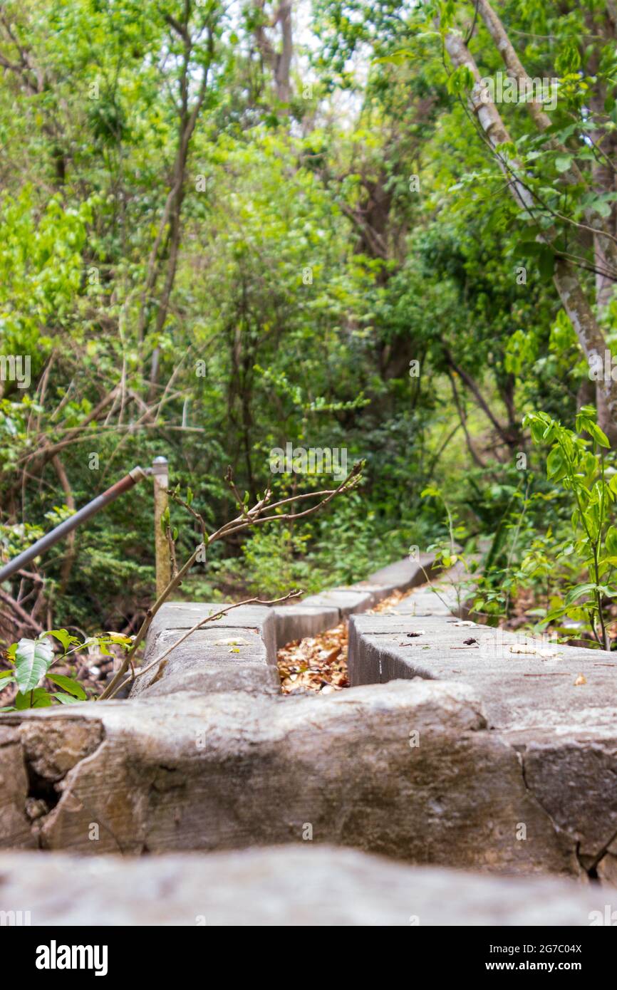 A stone trough, used to move water for sugar cane processing that took ...