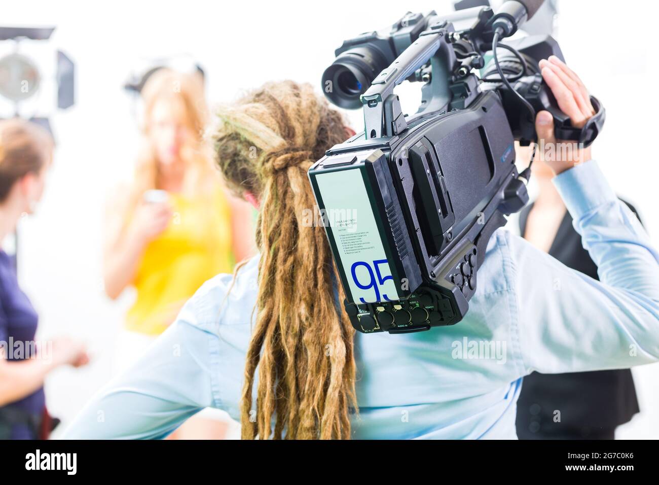 Camera man filming on set for video production a scene situation with ...