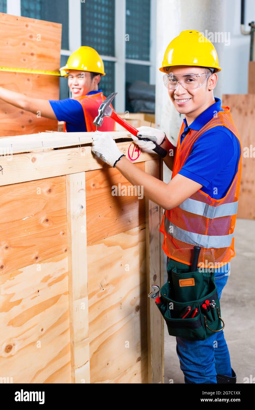 Hammer nail gloves hi-res stock photography and images - Alamy