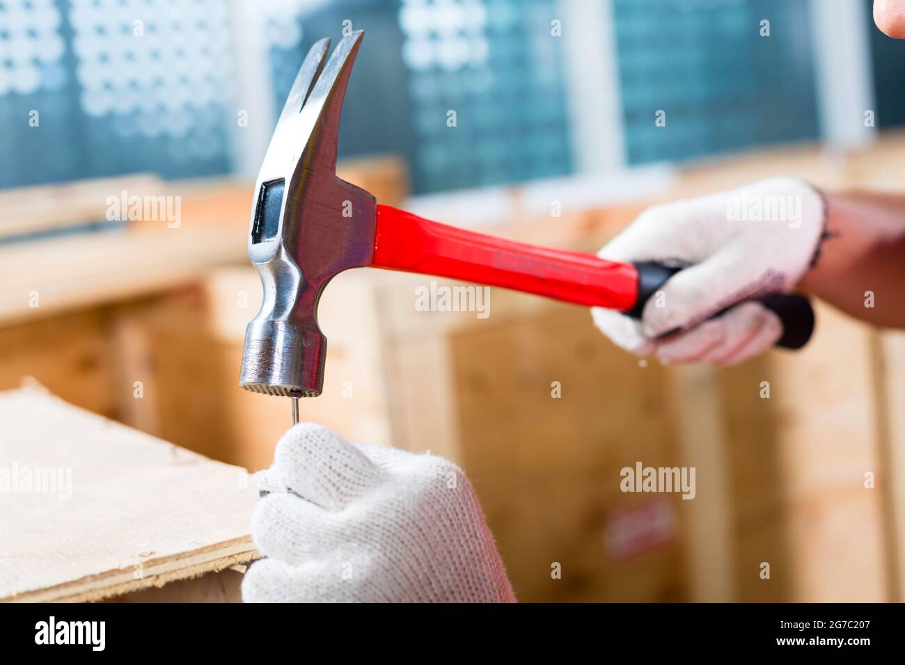 construction worker on a building site close a wood box or cargo ...