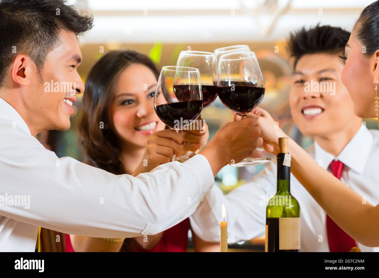 Two Asian Chinese Couples or friends or business people toasting during ...