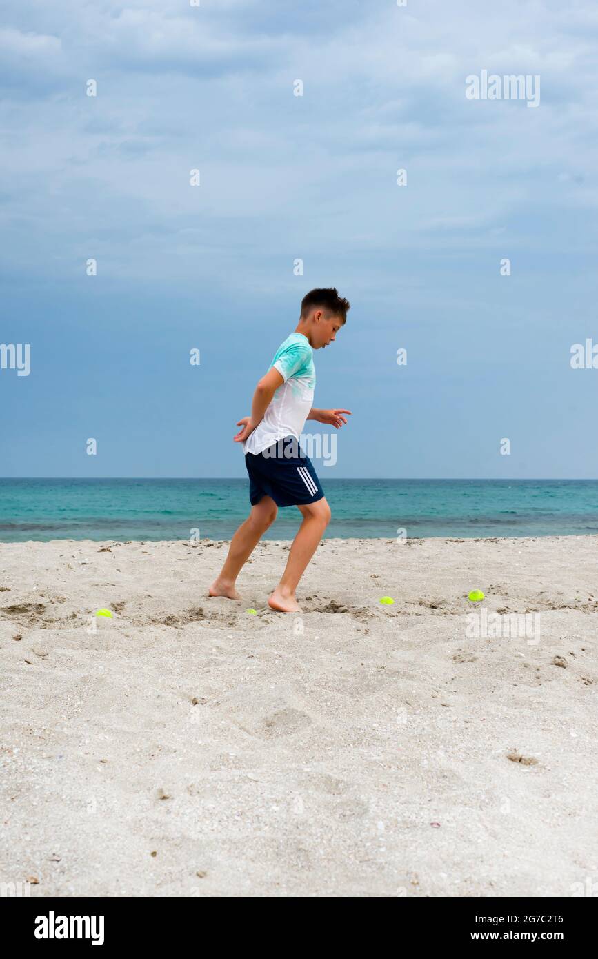 Trainings on the sandy beach. Physical training of athletes Stock Photo ...