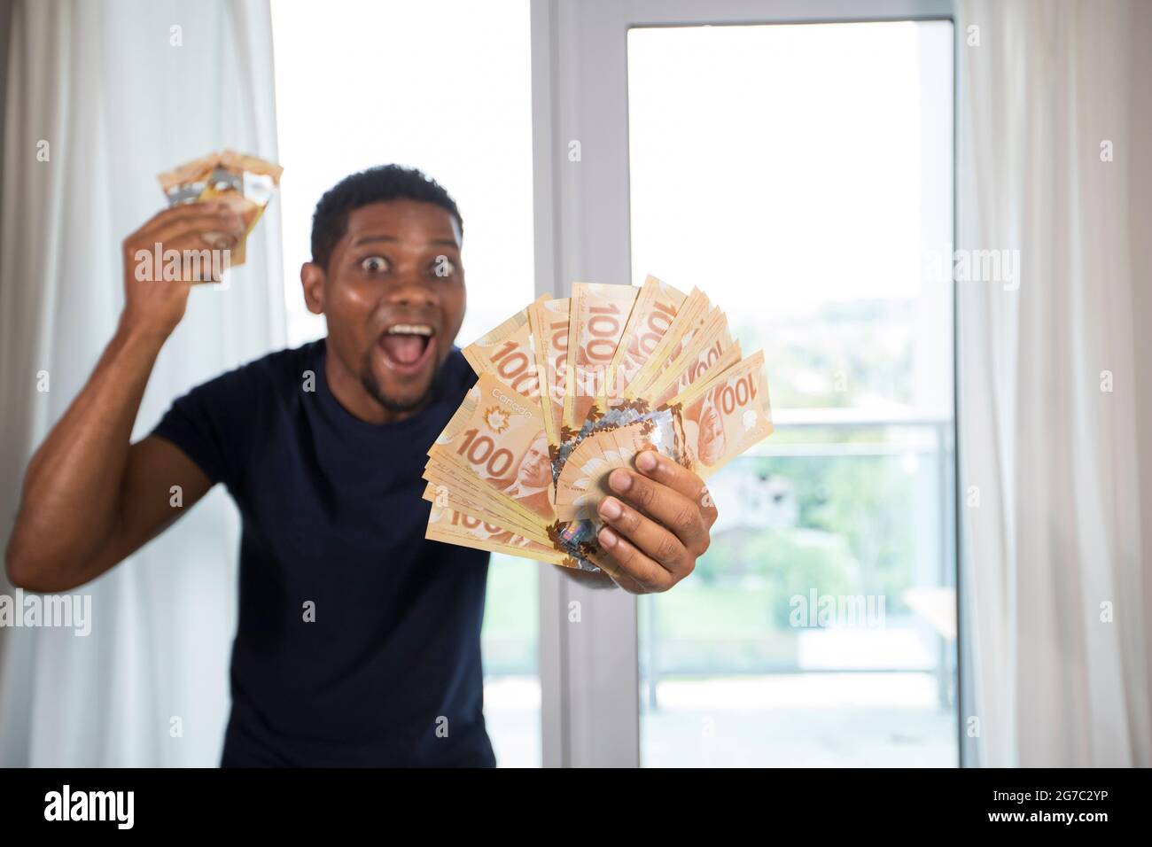 Canadian money hand hi-res stock photography and images - Alamy