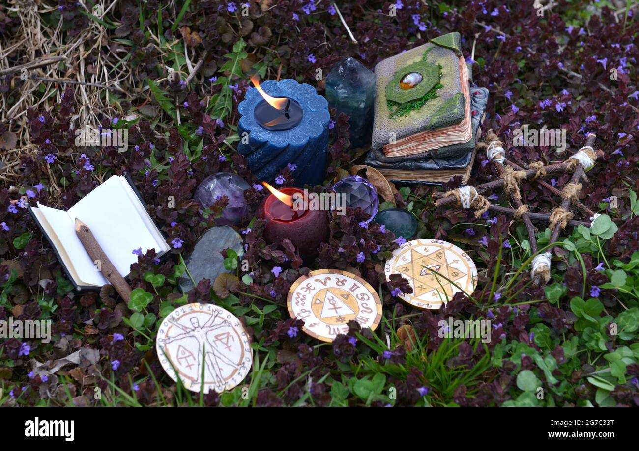 Magic ritual with pentagram, witch decorated book of spells and burning ...