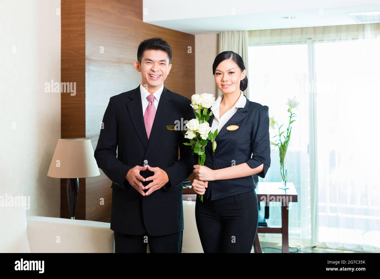 Hotel Manager or director and supervisor welcome arriving VIP guests ...
