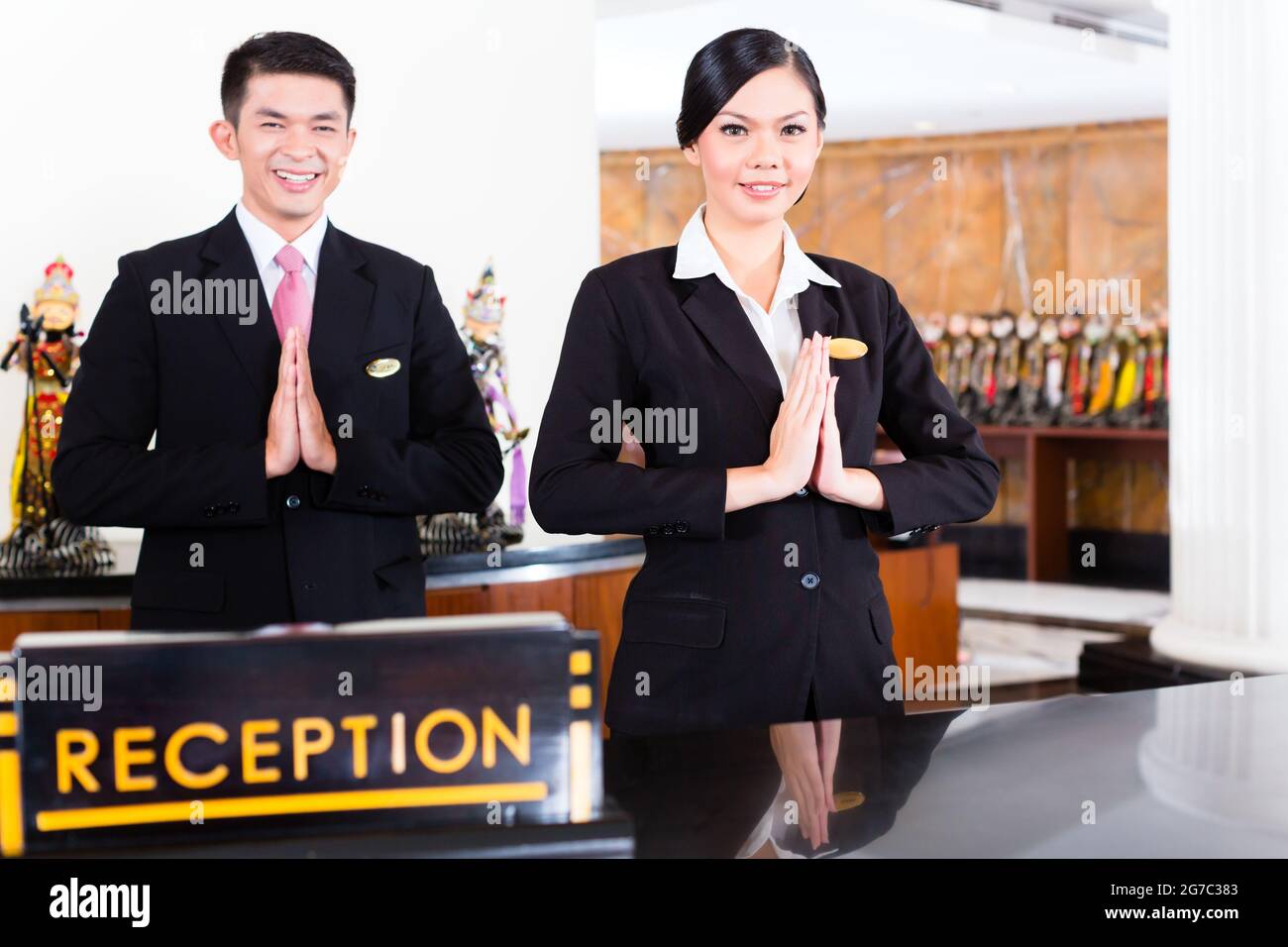 Chinese woman hotel receptionist hi-res stock photography and images ...
