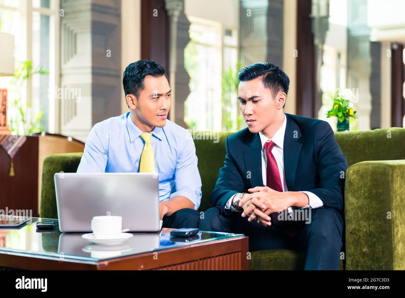 Asian Businessmen having meeting Stock Photo - Alamy