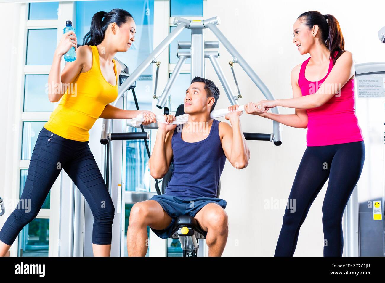 Women fighting over man in Asian gym Stock Photo - Alamy
