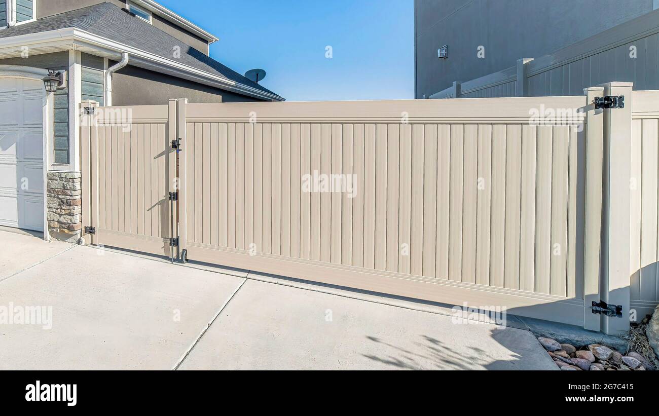 Pano Wide gate that leads to the yard beside the detached two car ...