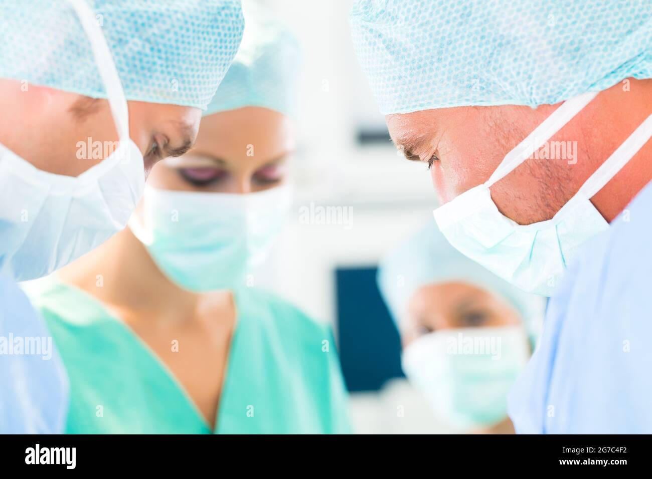 Hospital - surgery team in operating room or Op of a clinic operating ...
