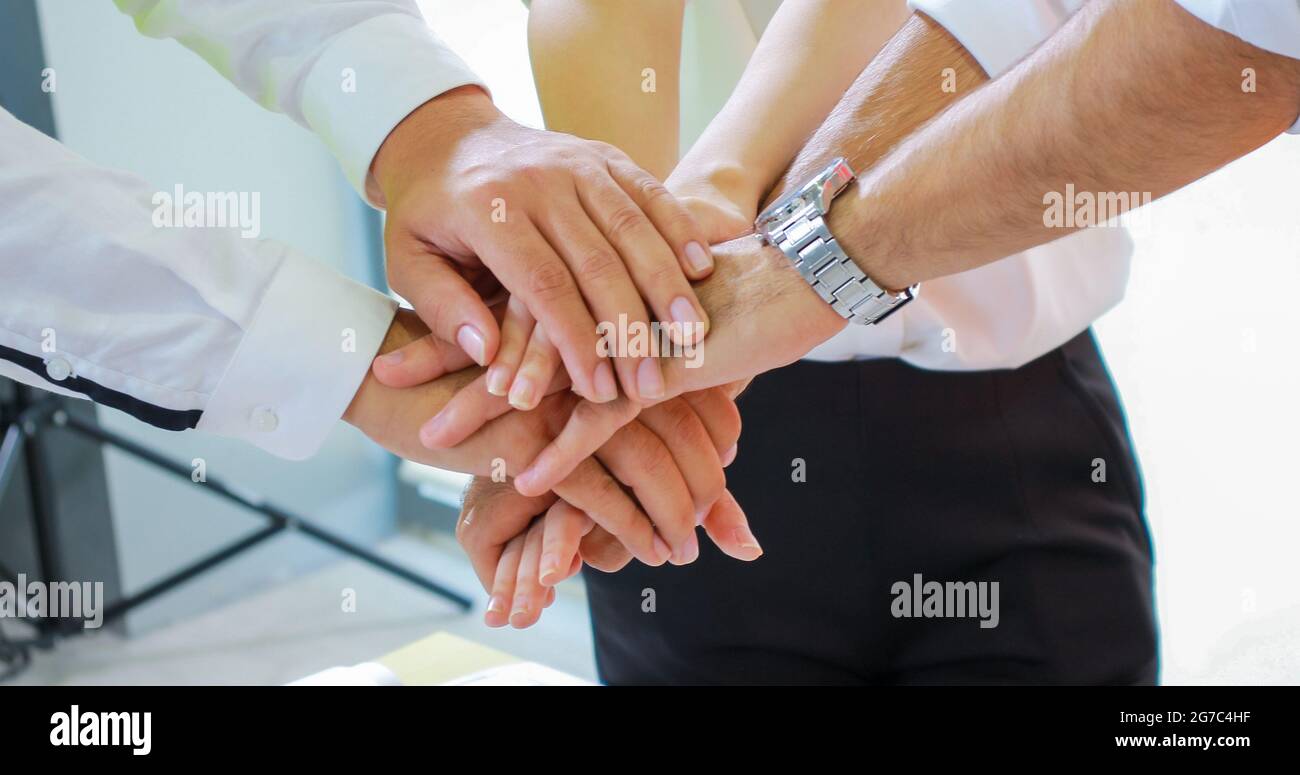 group of business people working in team ฺbrainstorming stacking hands ...