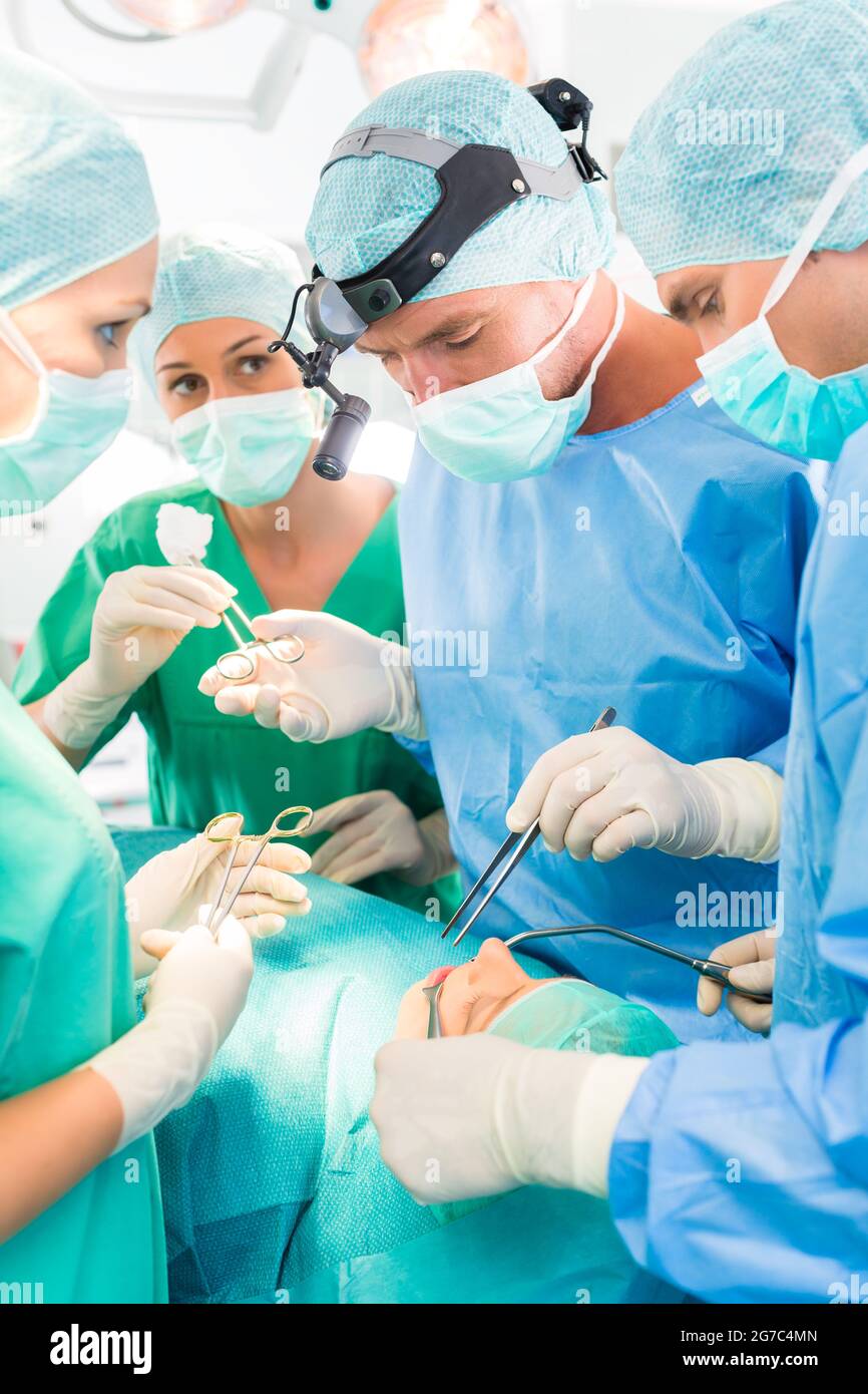 Hospital - surgery team in the operating room or Op of a clinic ...