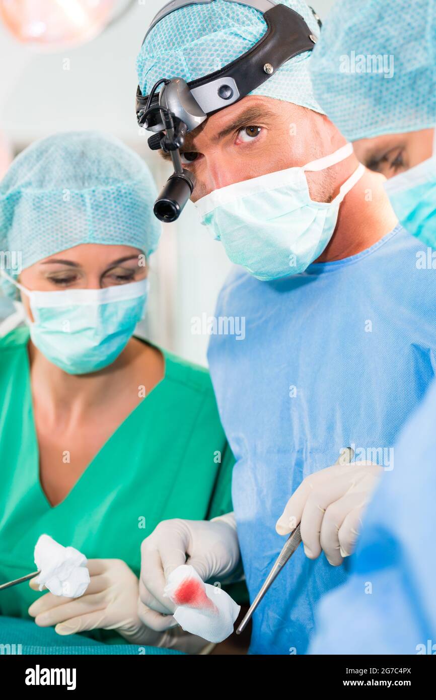 Hospital - doctor surgery team in the operating room or theater of ...