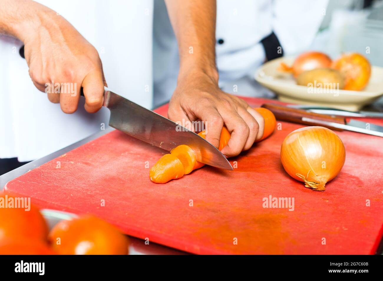 Asian Indonesian chef along with other cooks in restaurant or hotel ...